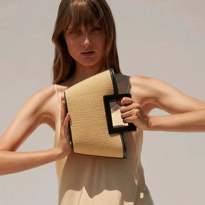 Bianca - Chic textured clutch with eye-catching handle – DESTINY